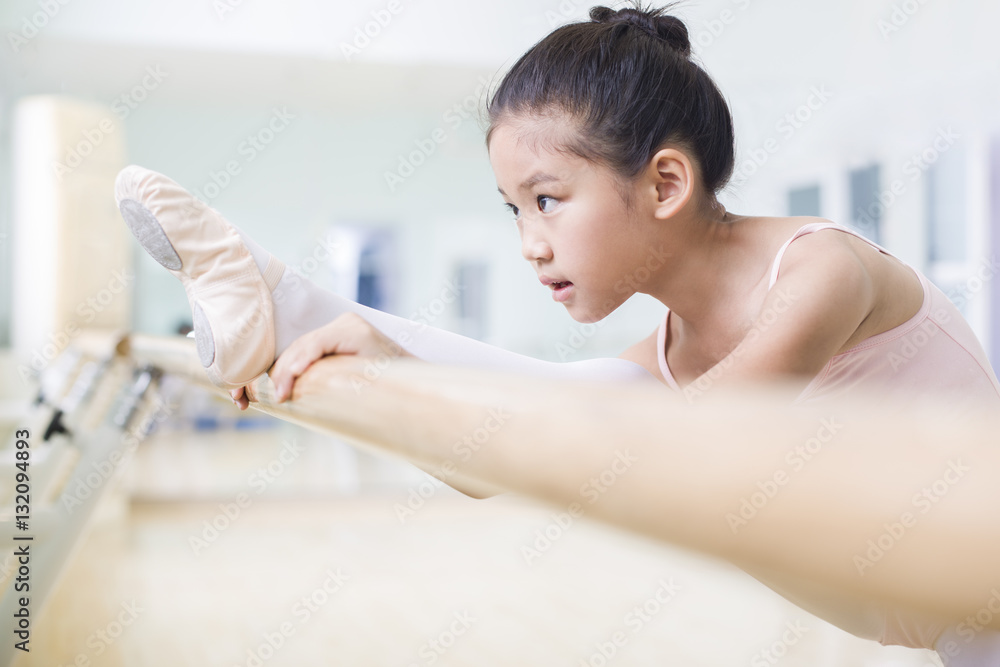 Girl practicing ballet dance in studio Stock Photo | Adobe Stock