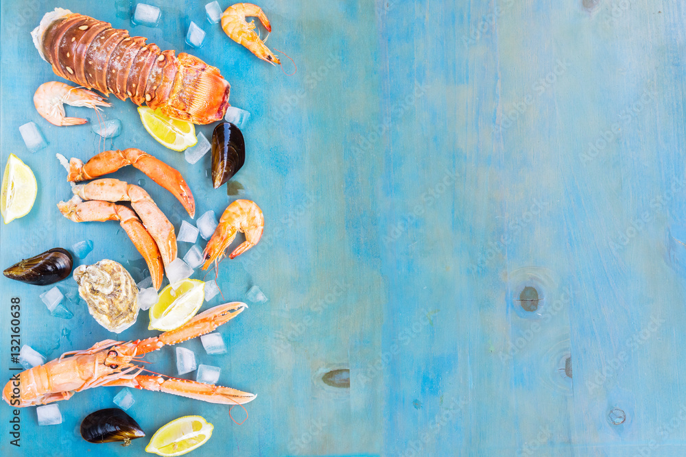 Fresh seafood border with copy space on blue background Stock Photo ...
