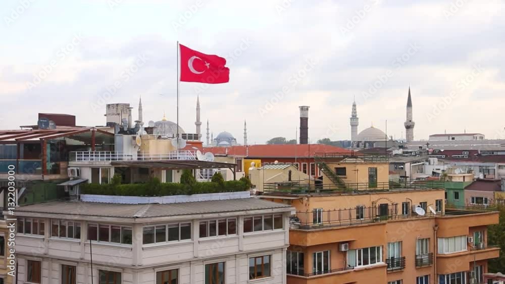 Turkish flag over Istanbul rooftops with mosques on background. Flag ...