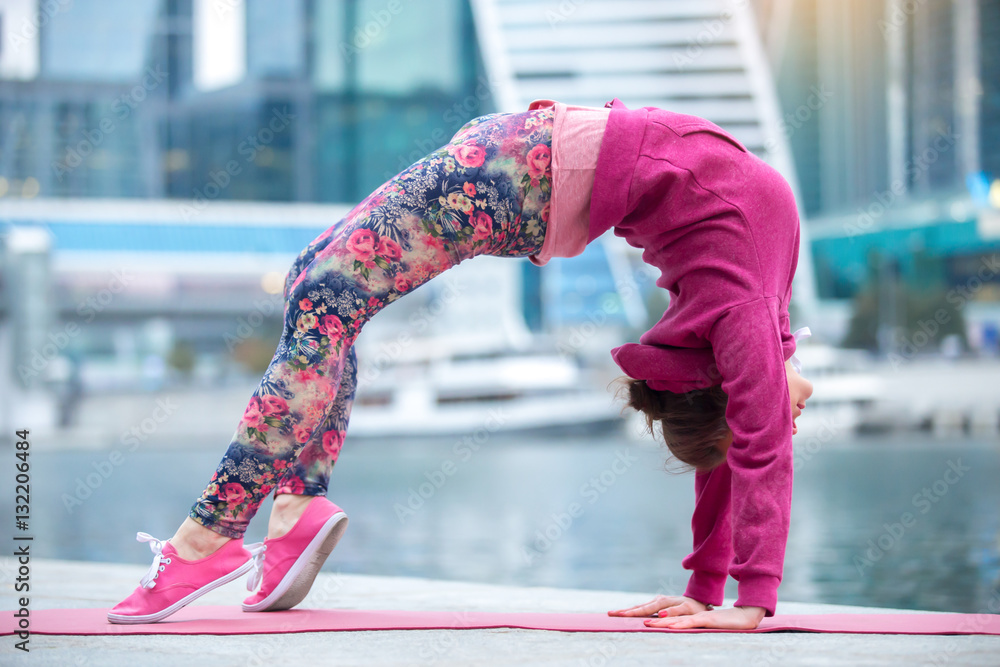 Young Attractive Woman Practicing Yoga Standing In Bridge Exercise