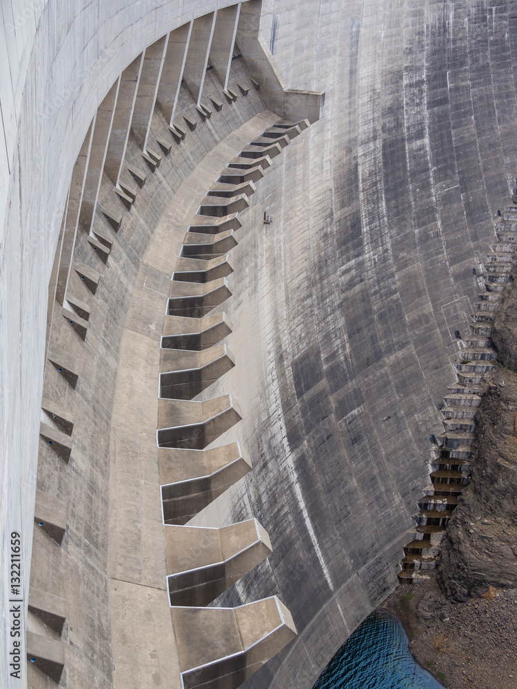 Concrete dam wall and overflow of impressive Katse Dam hydroelectric ...
