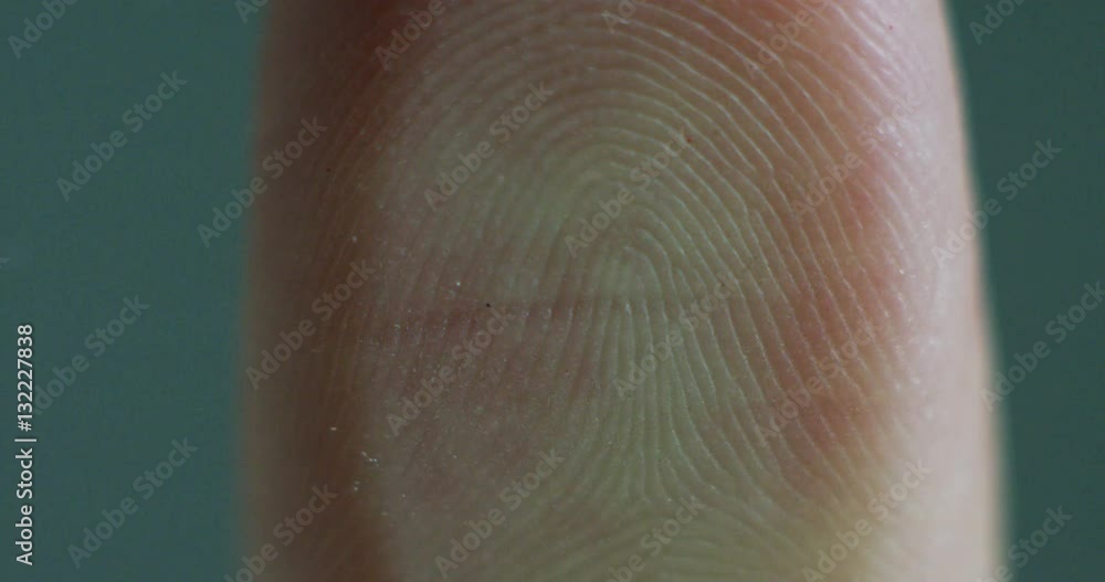 fingerprint leaning on control glass for biometric scan. concept of ...