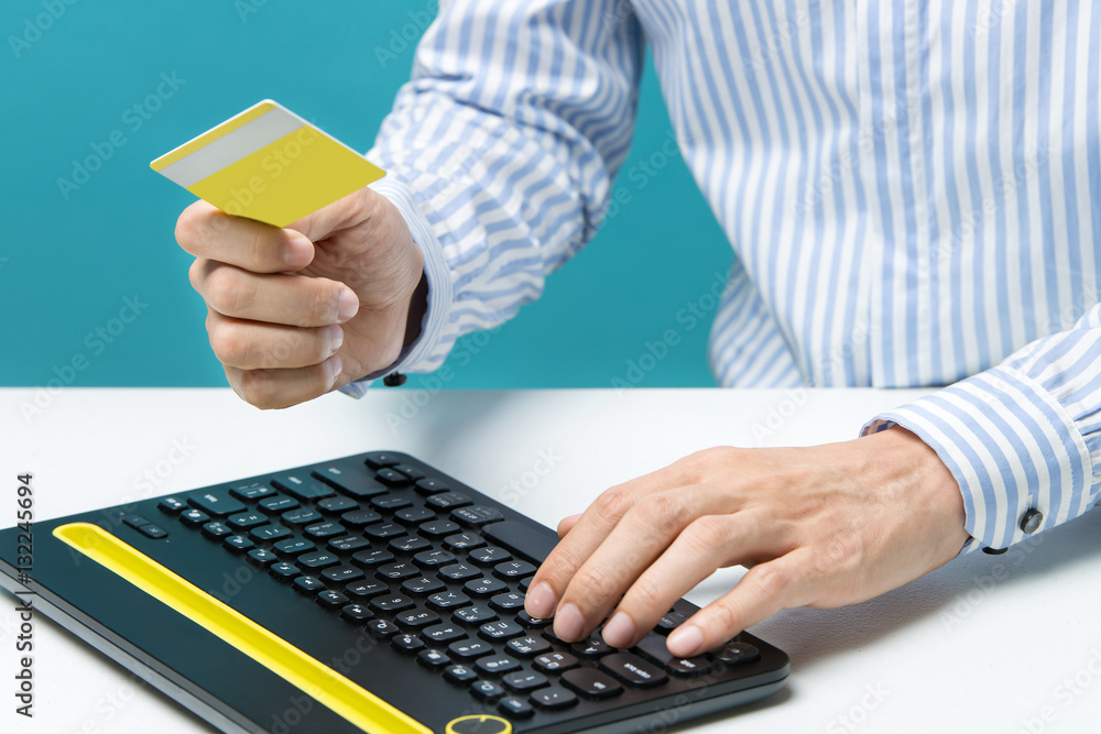 Man hands using keyboard and holding credit card with social media as ...