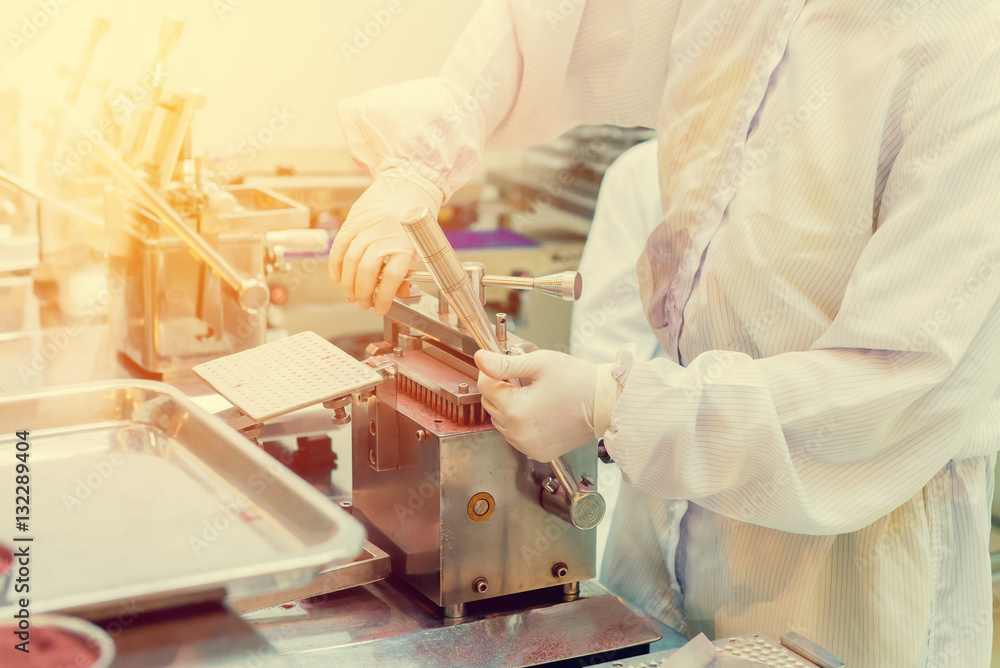 pharmacist preparing medication with packaging capsule in lab Stock ...