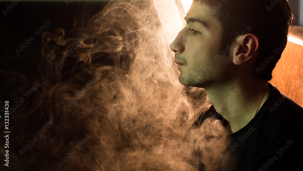 Young handsome guy smoking hookah alone closeup Stock Photo | Adobe Stock