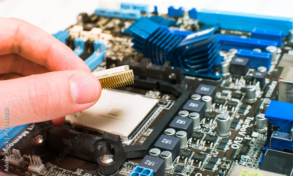 Installing the CPU into the motherboard Stock Photo | Adobe Stock