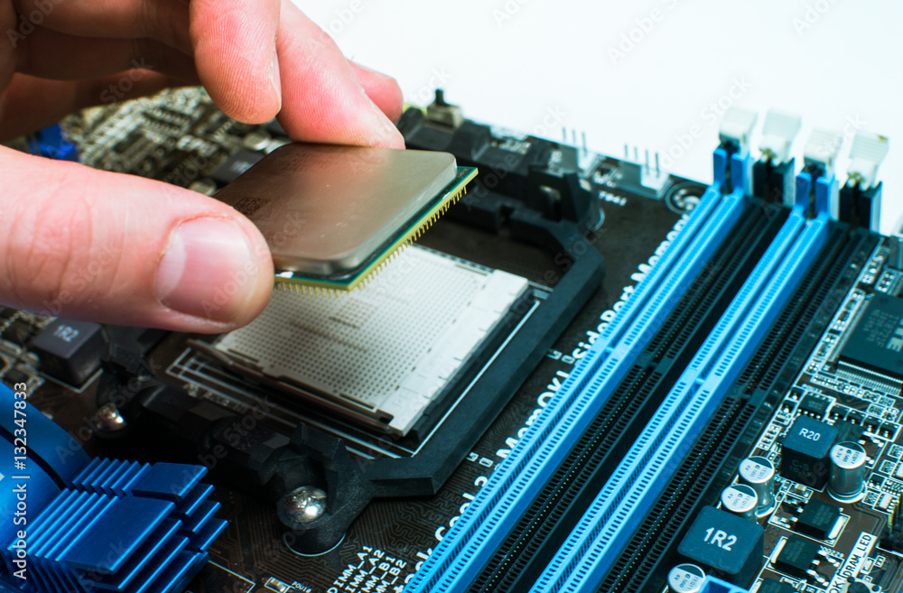 Installing the CPU into the motherboard Stock Photo | Adobe Stock