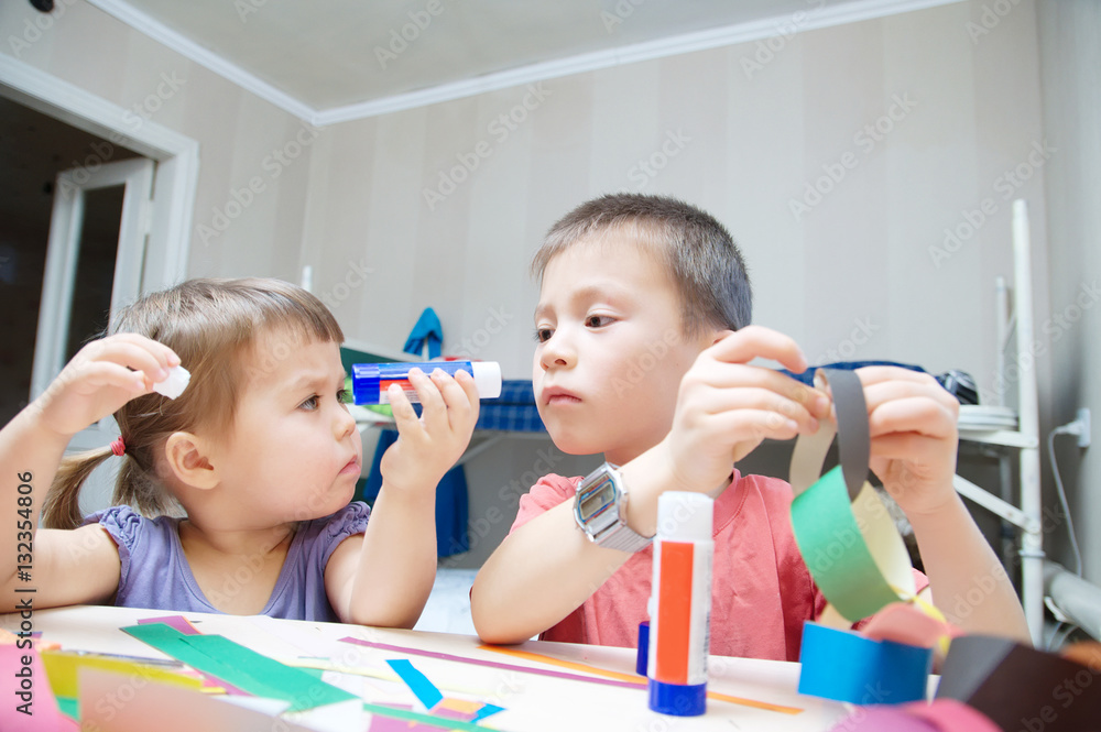 children development - brother and sister making craft Stock Photo ...