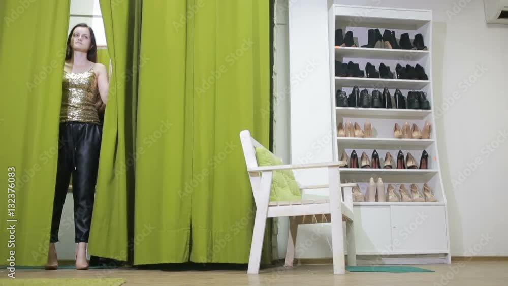 beautiful girl chooses shoes in a store Stock Video | Adobe Stock