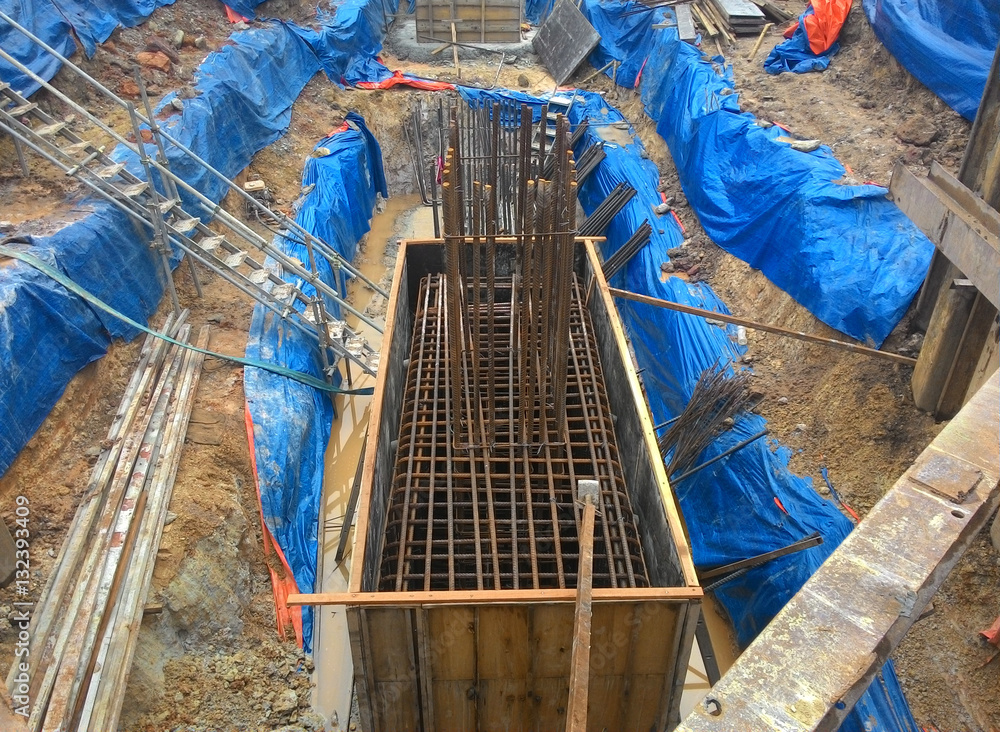 Pile cap form work with reinforcement bar in it at construction site in ...