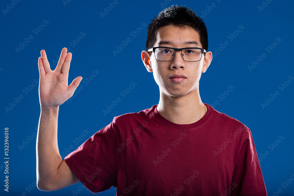 nerd trekkie salutation by an asian guy Stock Photo | Adobe Stock
