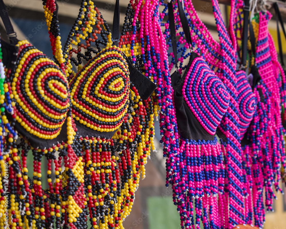 Traditional African handmade colorful beads clothes. Folk art. Local ...