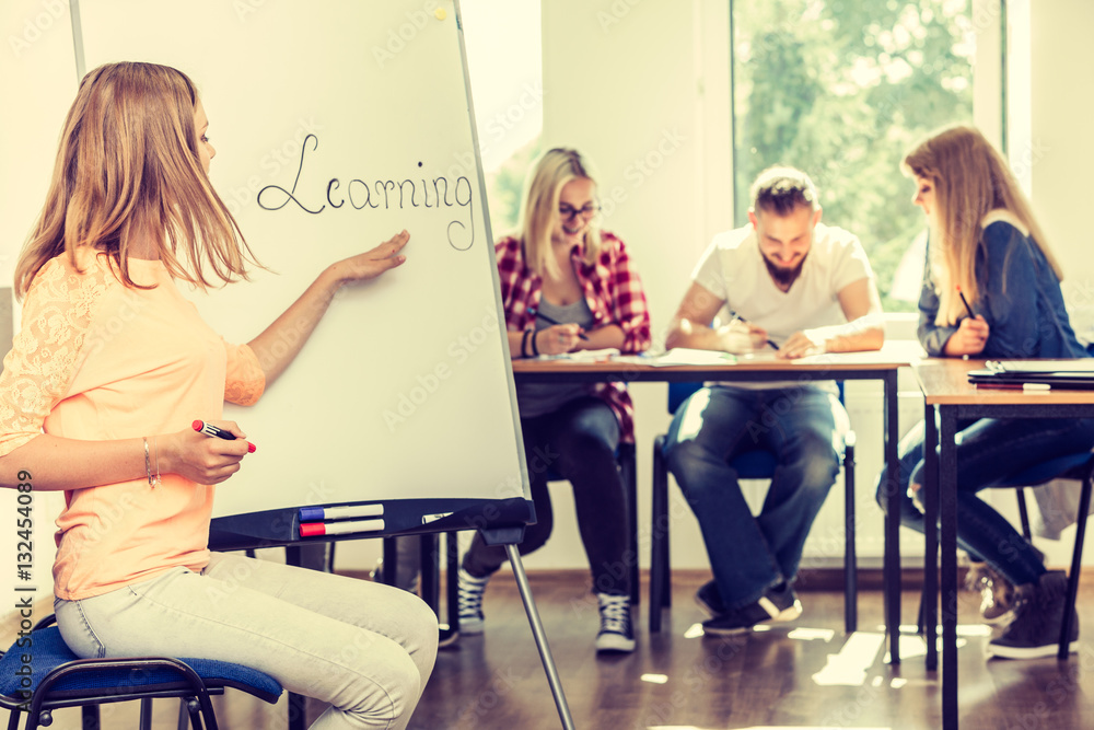 Student girl writting Learning word on whiteboard Stock-Foto | Adobe Stock
