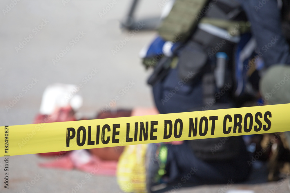 police line do no cross with blurred medic law enforcement background ...