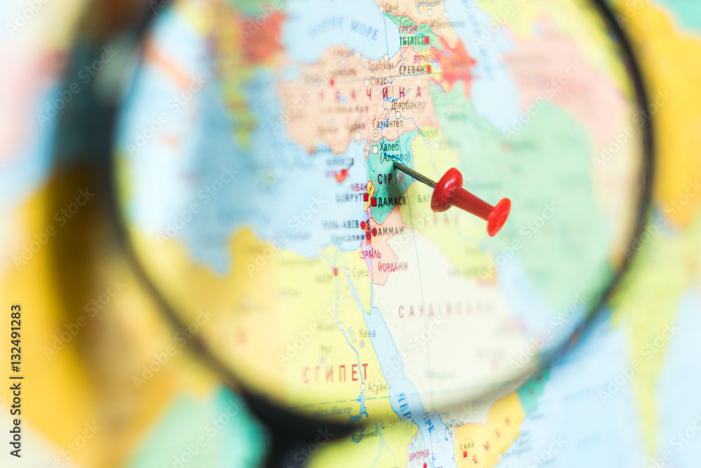 Syria on the world map with a magnifying glass Stock Photo | Adobe Stock