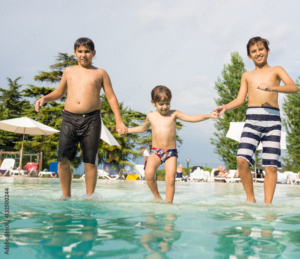 Happy time for kids of fun and enjoyment on summer swimming pool Stock ...