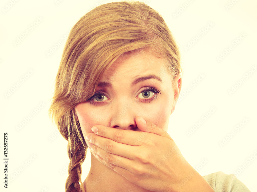 Sad woman covering mouth with hand Stock Photo | Adobe Stock