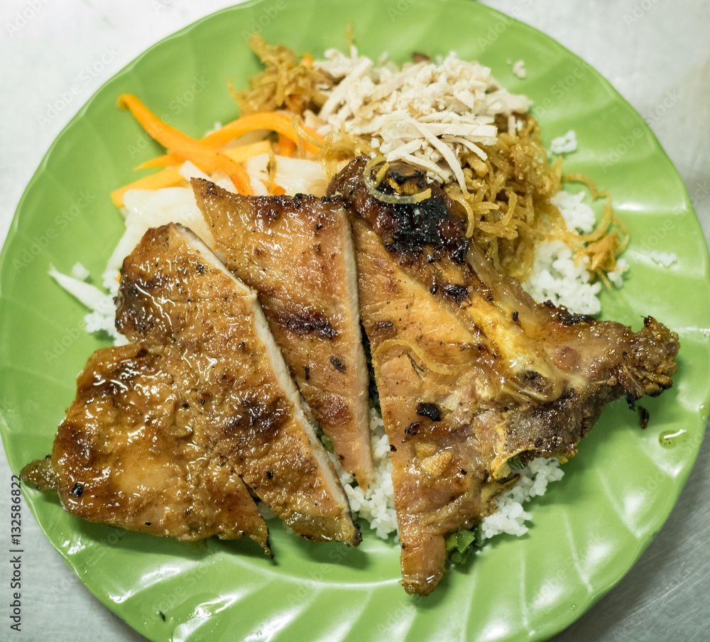 Vietnamese broken rice with grilled pork chop, one of the popular ...