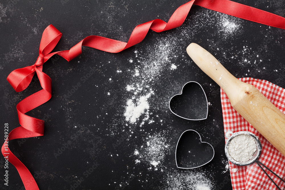 Baking background with flour, rolling pin and heart shape on kitchen ...