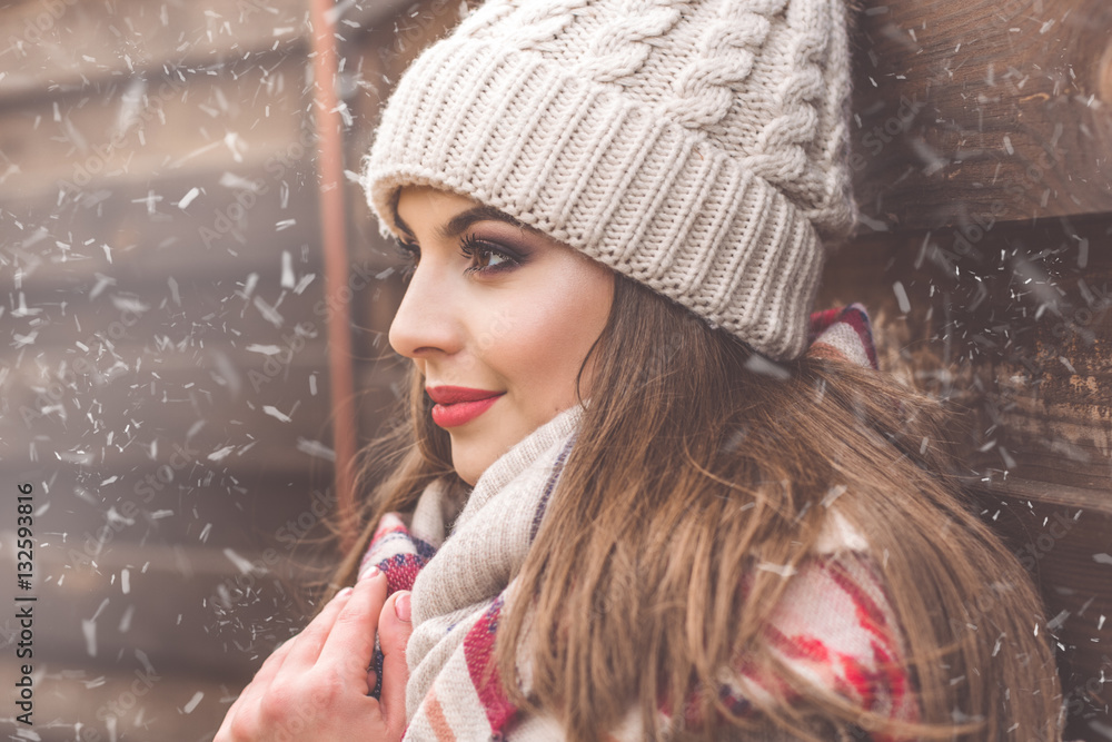 Pretty girl is wearing warm winter clothes Stock Photo | Adobe Stock