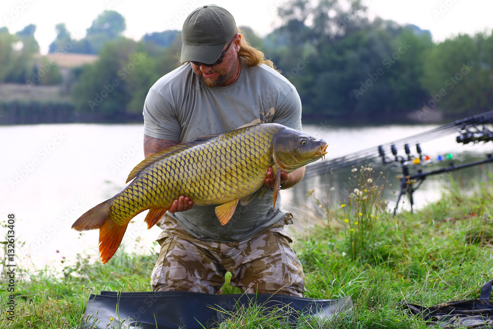 Carp and Fisherman, Carp fishing trophy. Stock-Foto | Adobe Stock