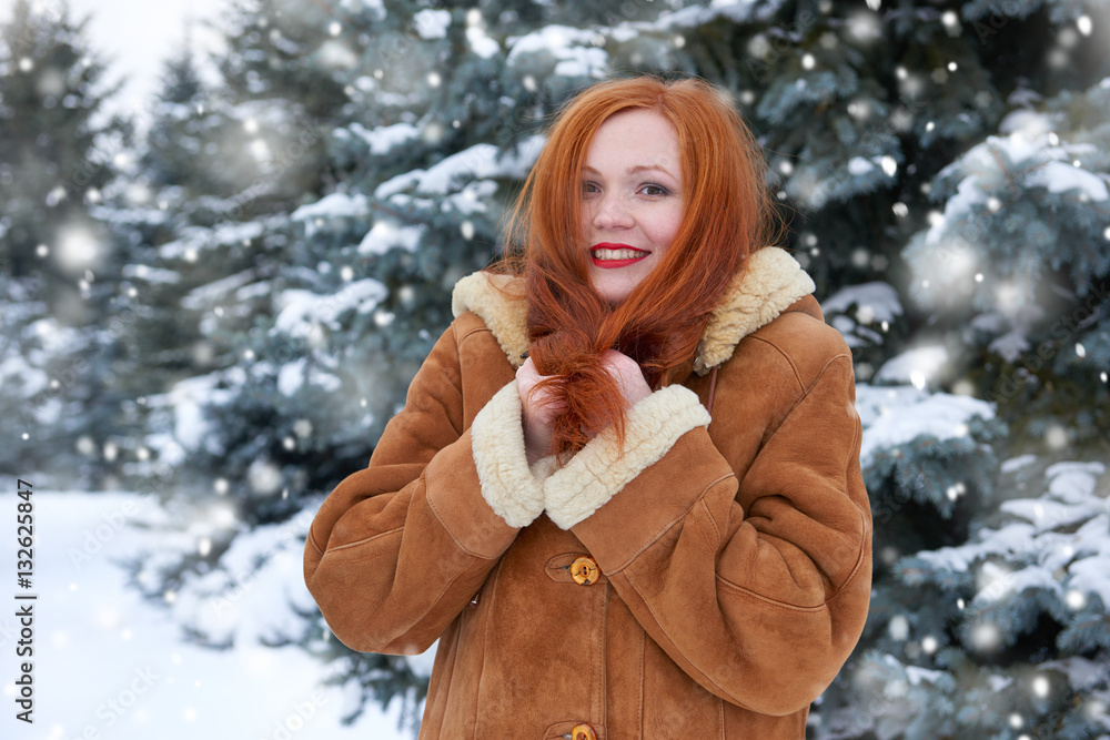 beautiful woman on winter outdoor, snowy fir trees in forest, long red ...