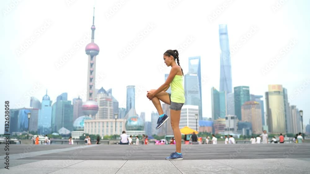 Runner stretching glutes and arms after workout in Shanghai, China on ...