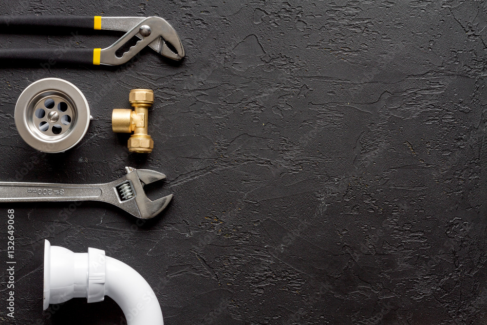 concept plumbing work top view on dark background Stock Photo | Adobe Stock