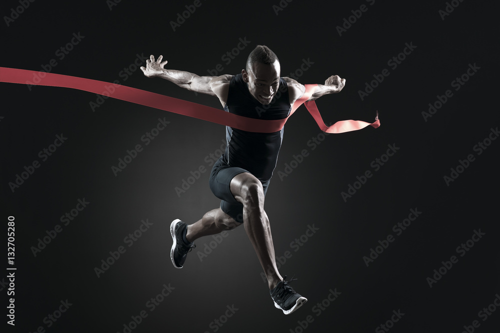 Runner crossing finish line Stock Photo | Adobe Stock
