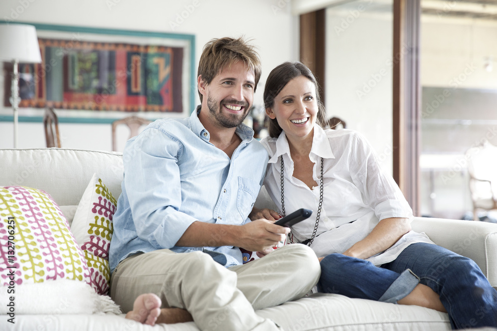 Couple watching TV together Stock Photo | Adobe Stock