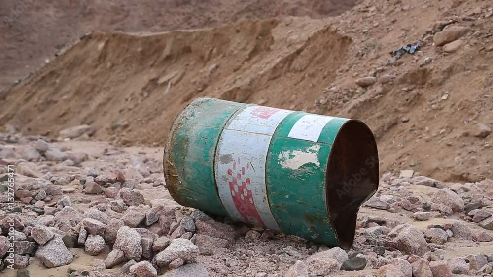 Stockvideo Iron barrel lies on the stony ground in Aqaba, Jordan. Old ...