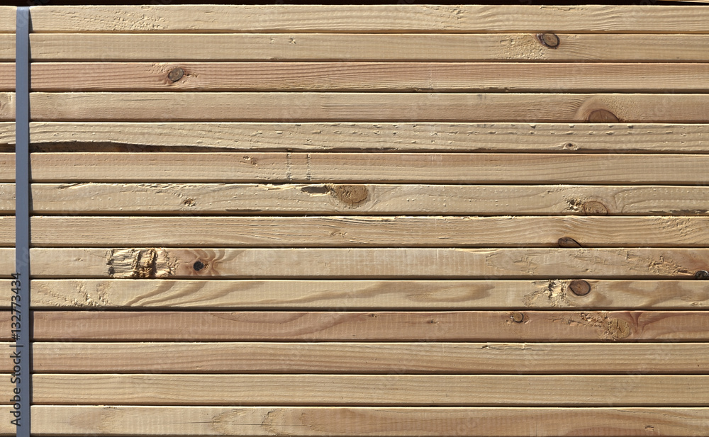 Construction lumber neatly stacked. Horizontal. Stock Photo | Adobe Stock