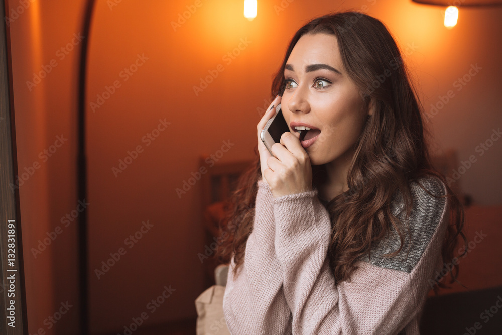 Surprised young woma in cafe talking by her phone Stock-Foto | Adobe Stock Surprised young woma in cafe talking by her phone Stock-Foto | Adobe Stock