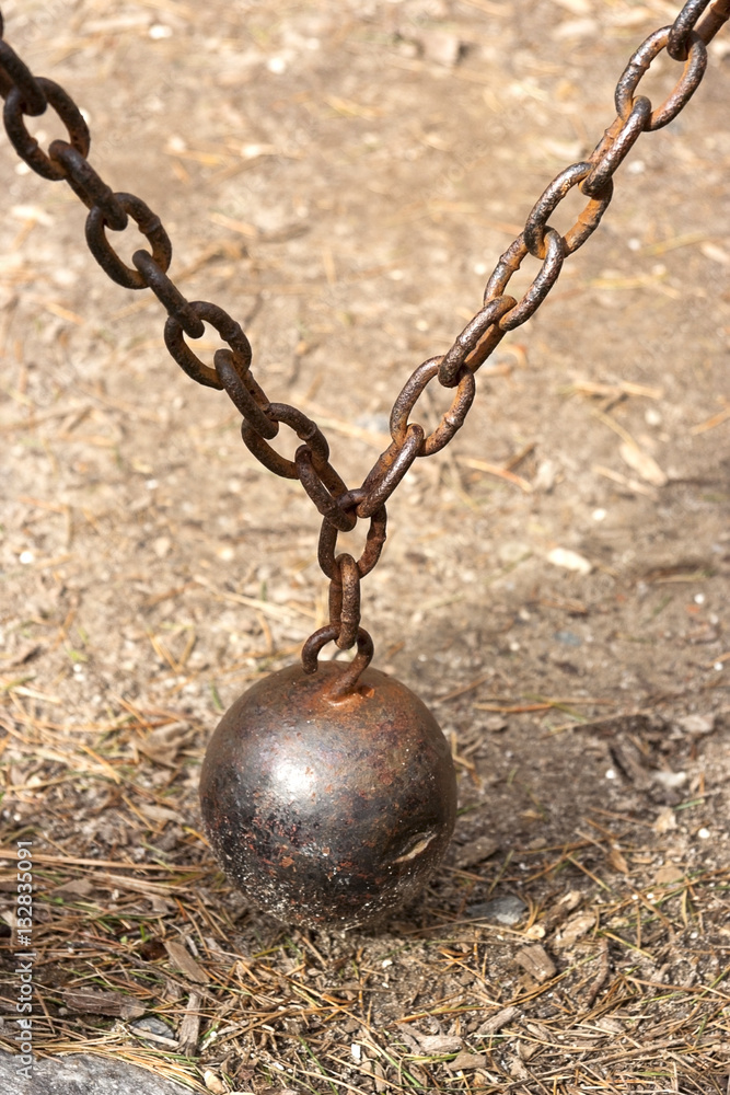 Old counterweight ball and chain still in use on gate. Vertical. Stock ...