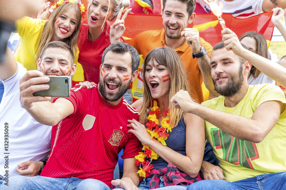 Soccer fans in stadium taking a selfie Stock Photo | Adobe Stock