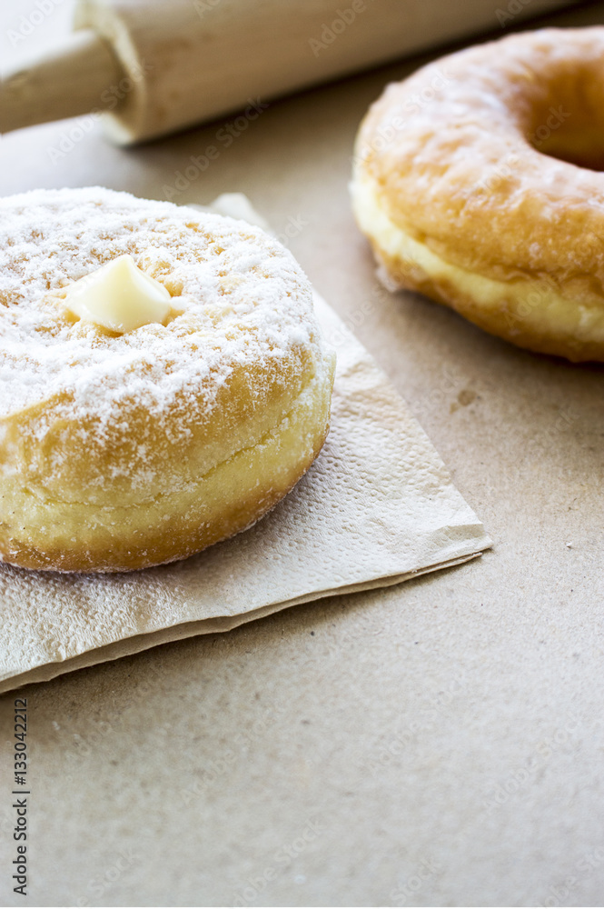 donut on paper texture with warm fall colors, soft-focus in the ...