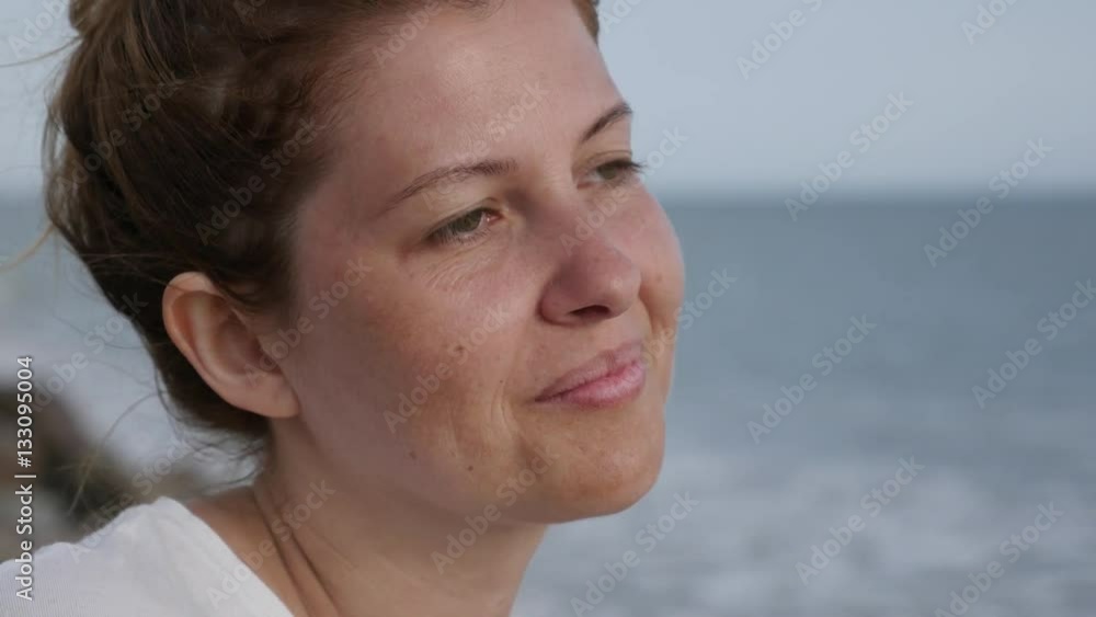 Woman on sandy beach relaxing before sunset 4K 2160p 30fps UltraHD ...