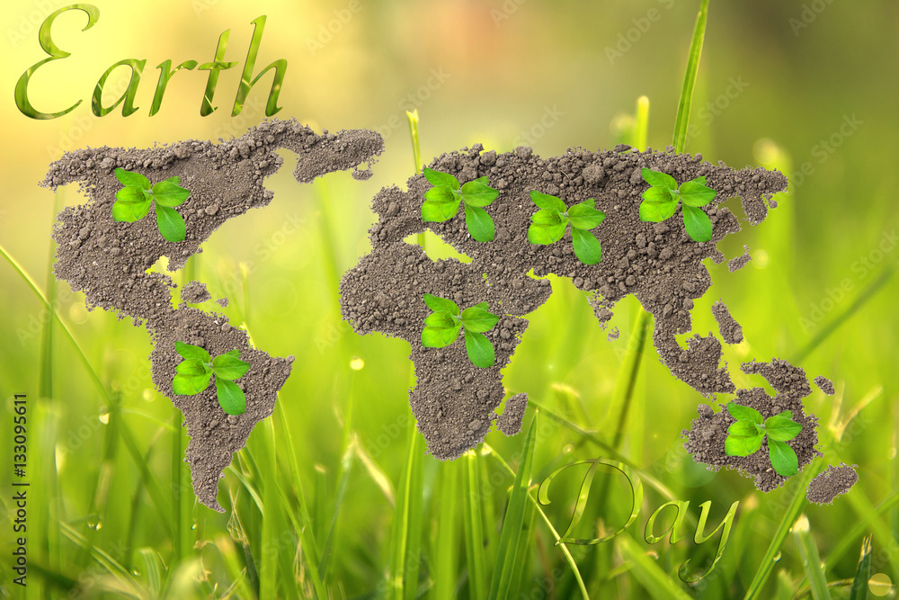 Earth Day. Concept ecology. World map, globe from the soil with green ...