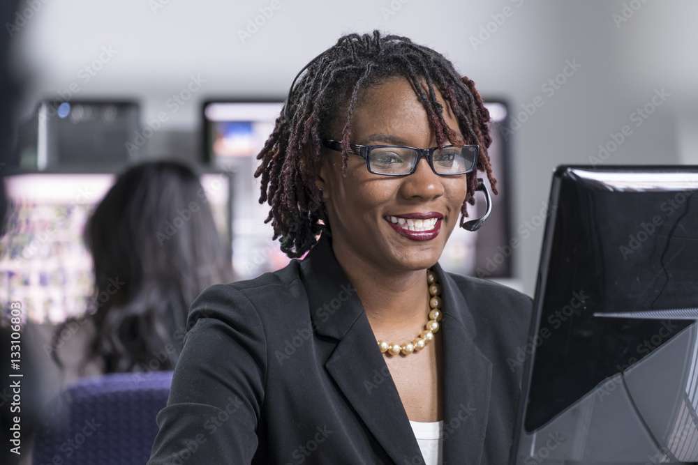 Young black professional woman working on computer at the office Stock ...