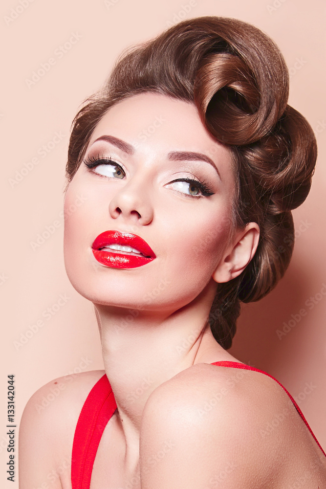 Beautiful girl in retro style on a pink background. The girl in style ...