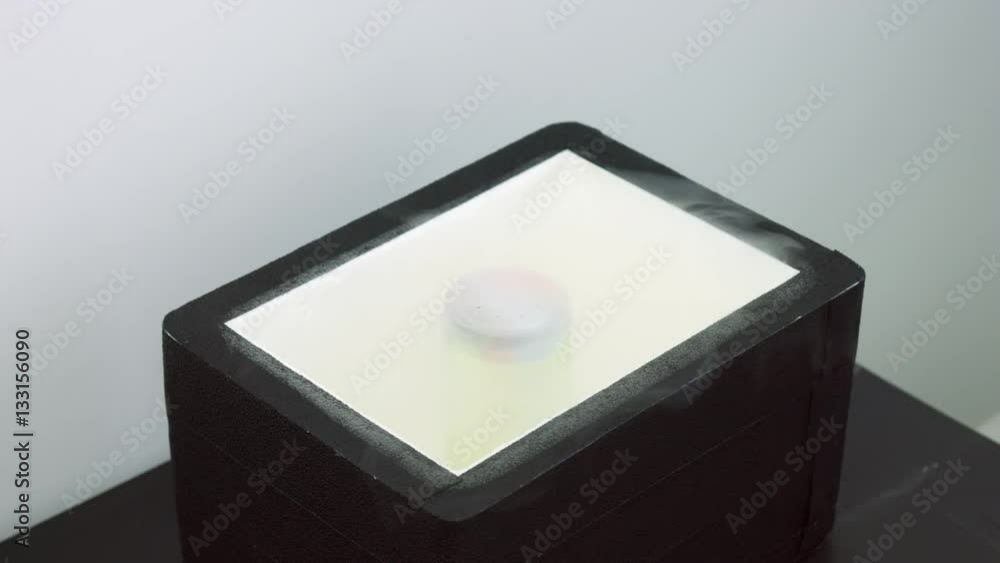 Video „Put plastic cup with frozen embryo in styrofoam box with liquid ...