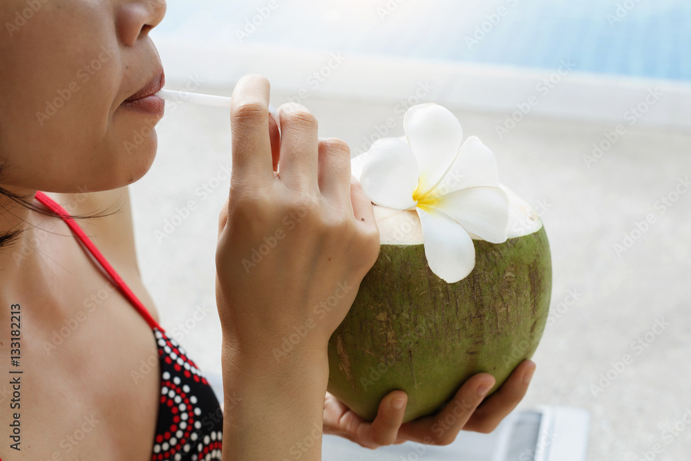 beautiful woman Drinking coconut Stock-Foto | Adobe Stock