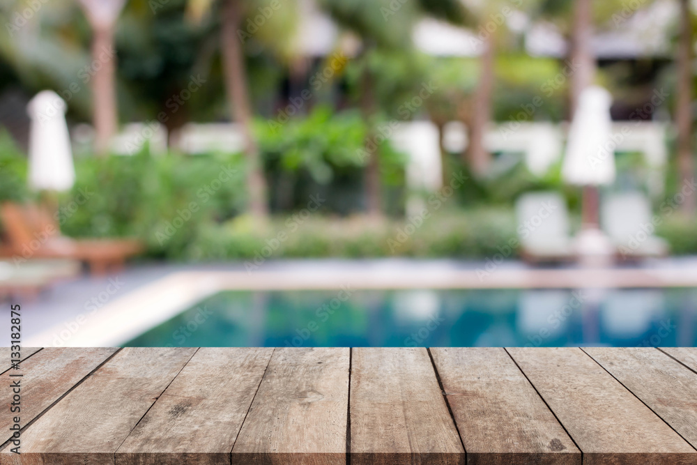 Wood table top and blurred swimming pool background. Stock Photo ...