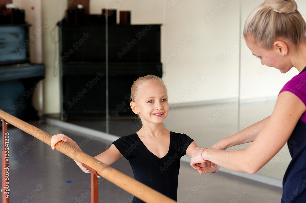 Coach teaches girl Ballet Stock Photo | Adobe Stock