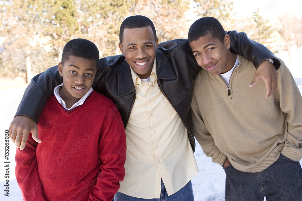 Portrait of African American teenage brothers smiling. Photos | Adobe Stock