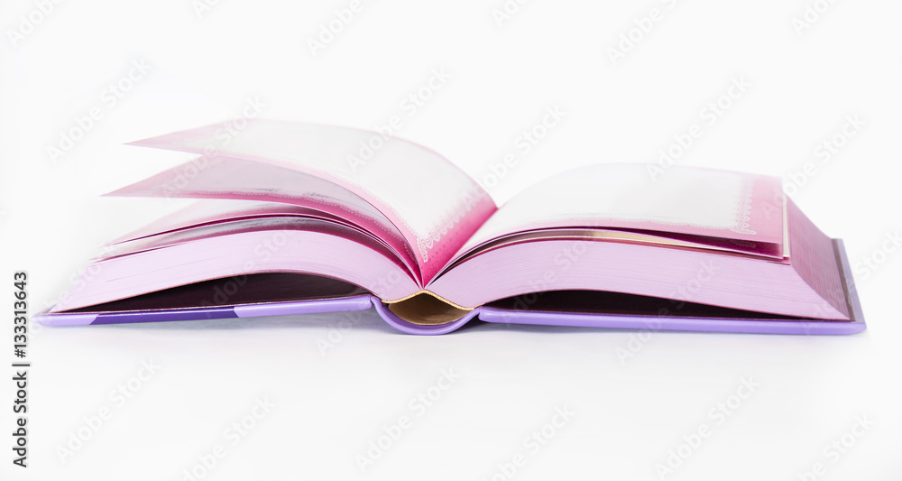 Isolated pink open book in lilac cover Stock Photo | Adobe Stock