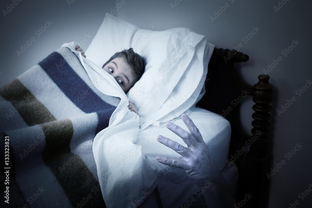 Foto de Scary hand coming out from under the bed do Stock | Adobe Stock