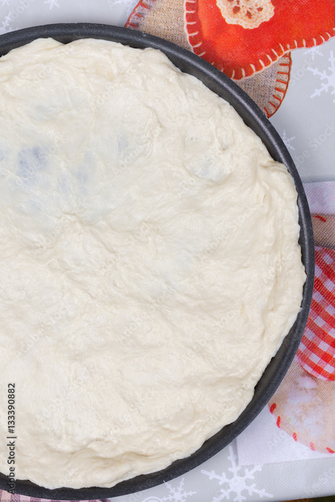 Empty pizza dough on the round baking plate Stock Photo | Adobe Stock
