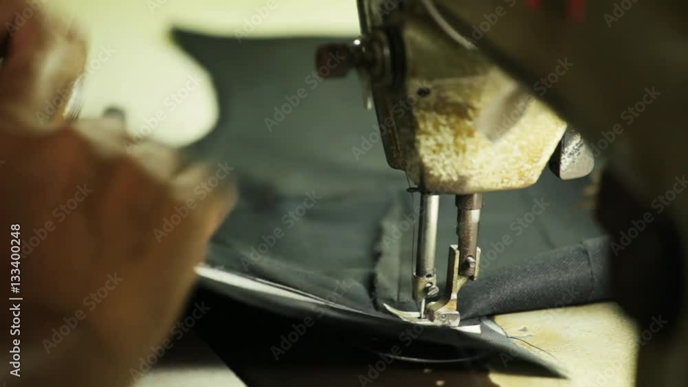 Sewing machine making stitches on a bespoke tailored suit Stock Video ...