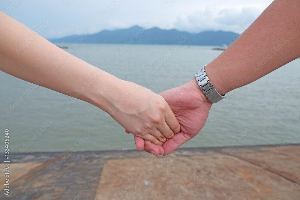 Lovely couple holding hands with nature background. Concept about love ...